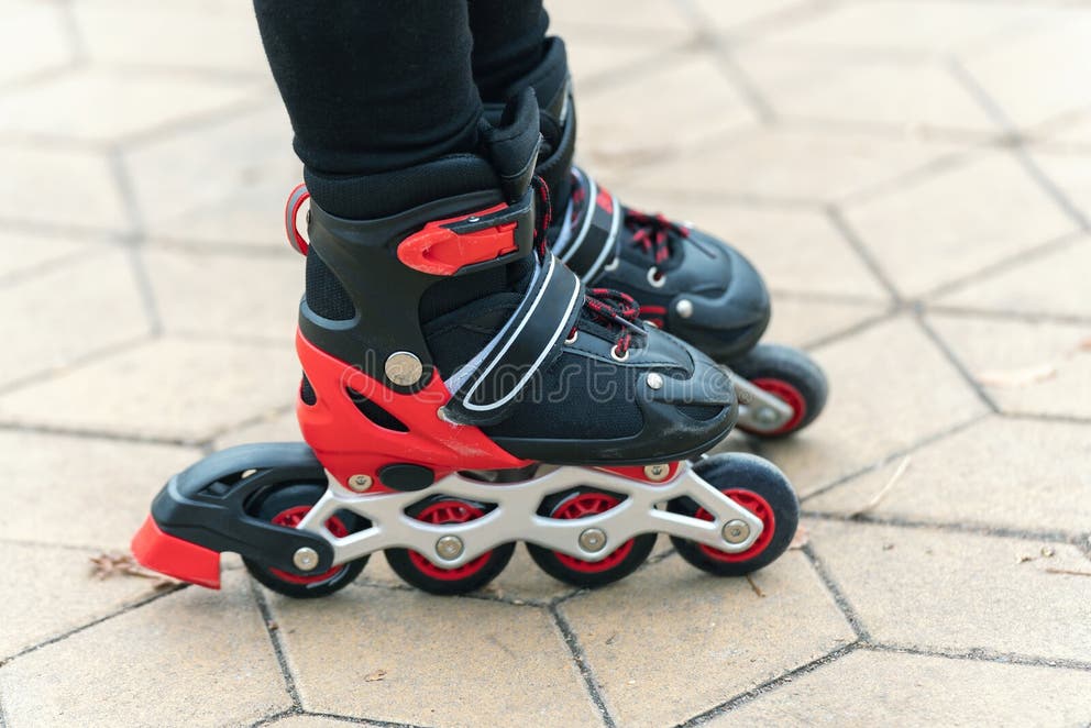 Legs of a Child Rollerblading in the Park Stock Photo - Image of ...