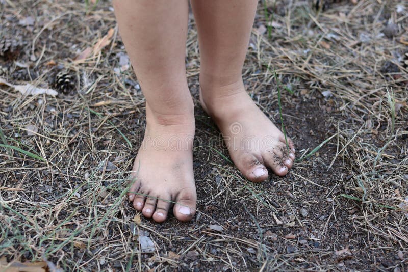 Legs of Child in Summer on Ground without Shoes Close-up Stock Image ...