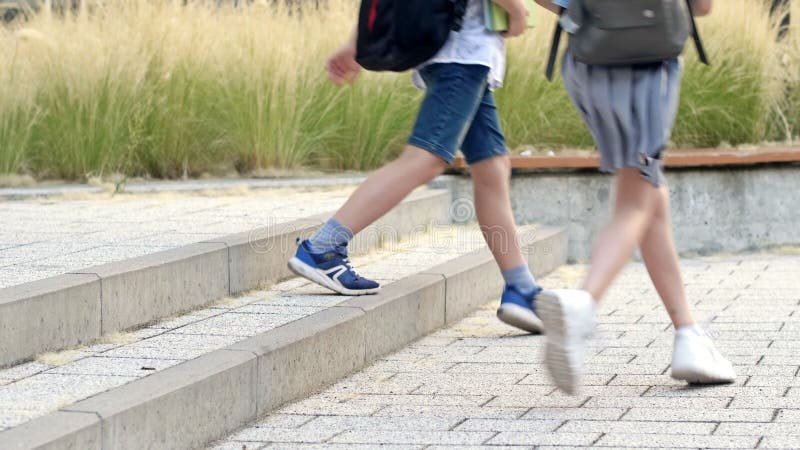 Legs of Elementary School Students Jumping Up the Stairs in the School ...