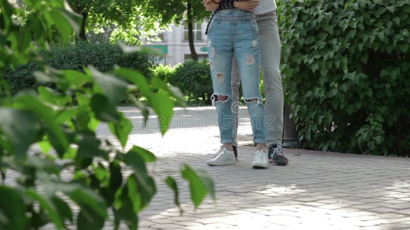 Legs of the Girl and the Guy a Hug in the Park Stock Video - Video of ...