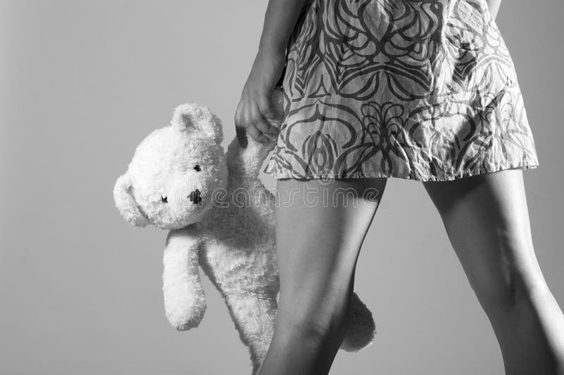 Legs of Girl Holding Teddy Bear Stock Photo - Image of growing, legs ...