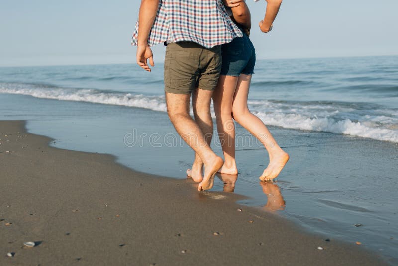 Legs go on the sea beach stock image. Image of feminine - 97443685