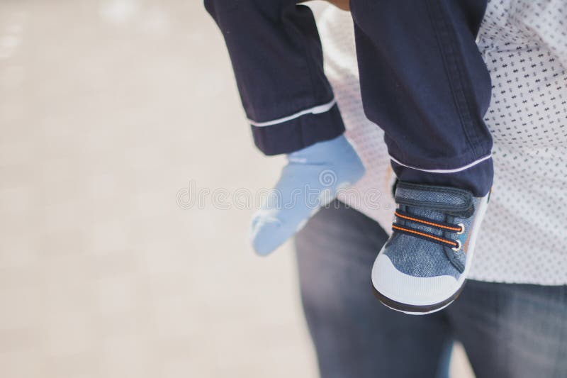 Legs of Little Boy, One Booty is Put on His Leg Stock Image - Image of ...