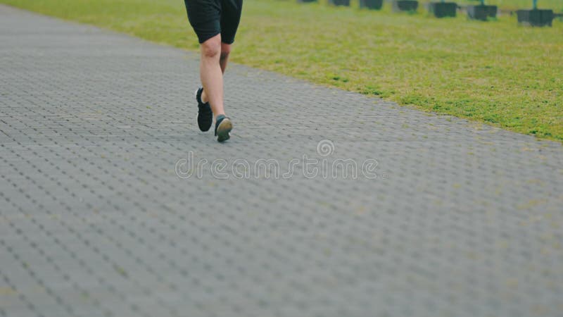 Legs of a Man Running Along the Path Stock Video - Video of full ...