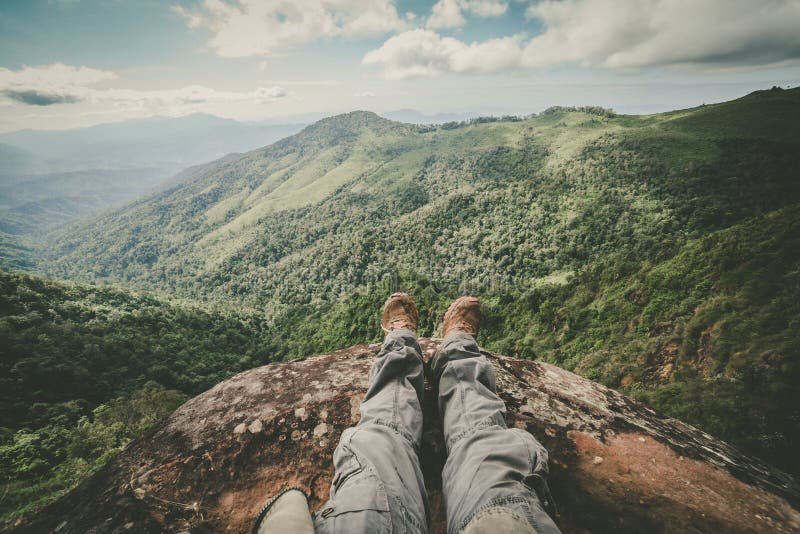 Legs of a Man Sitting on the Edge of a Cliff Stock Image - Image of ...