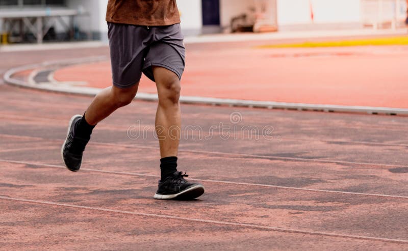 Legs of Men Jogging in a Running Track for Good Health Stock Photo ...