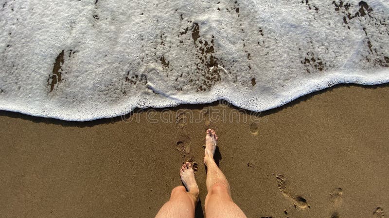 Legs from Point of View in Front of Sea Waves on the Shore Stock Image ...