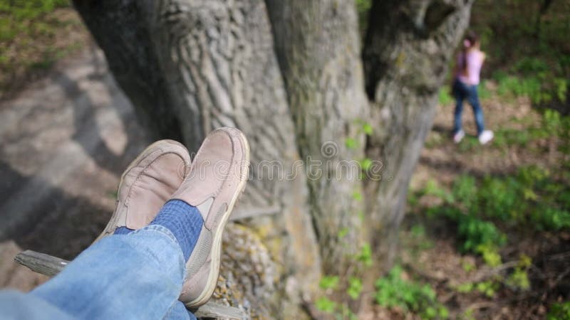 Legs Sitting Man on Tree in Front of Another Large Stock Footage ...