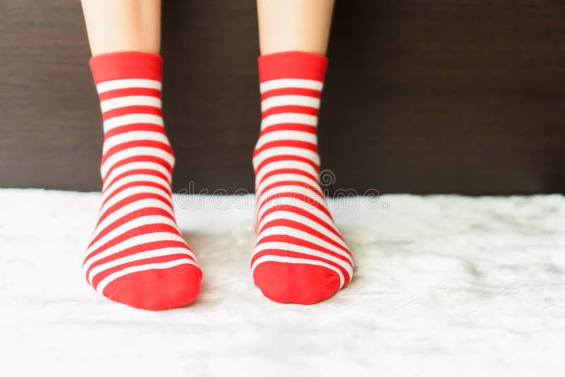 Legs in Socks Red Colors Alternate, White Side Stand on White Fabric ...