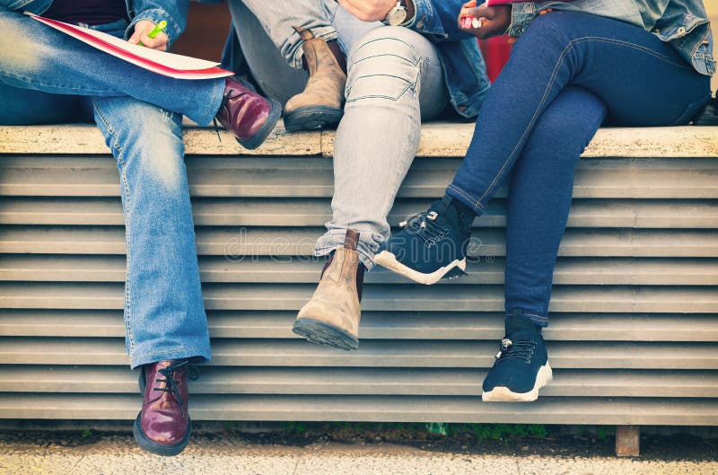 Legs of Students Sitting on a Bench Stock Image - Image of friends ...