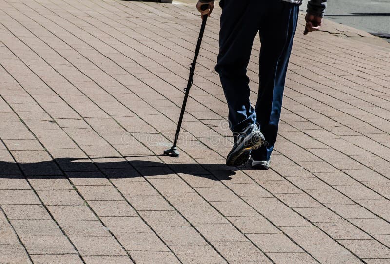Man Walking with Walking Sticks in Hand Stock Image - Image of outdoors ...