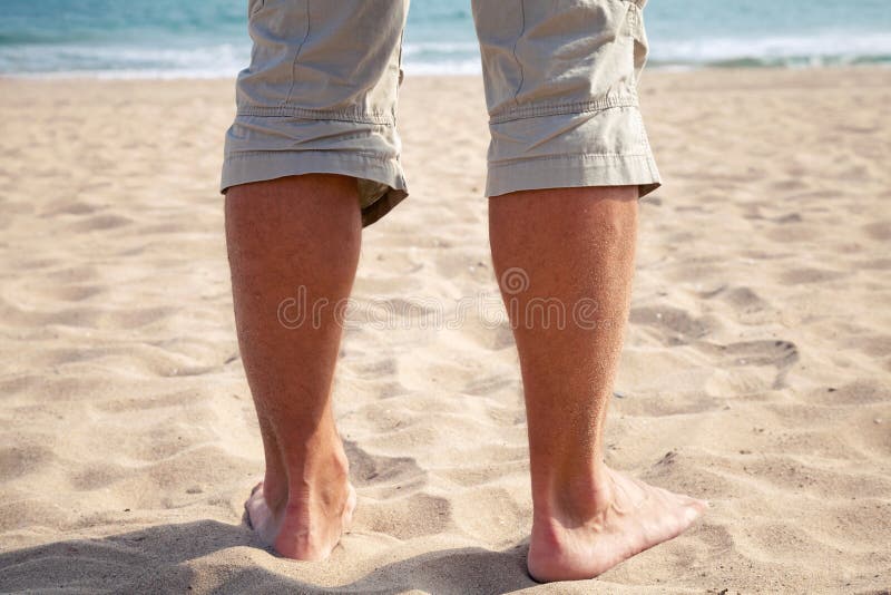 Legs of Young Caucasian Man on Sandy Beach Stock Image - Image of body ...