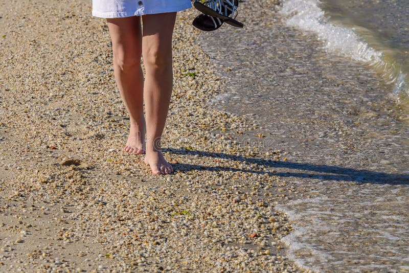 Legs of a Young Woman in the Surf Close Up Stock Image - Image of ...