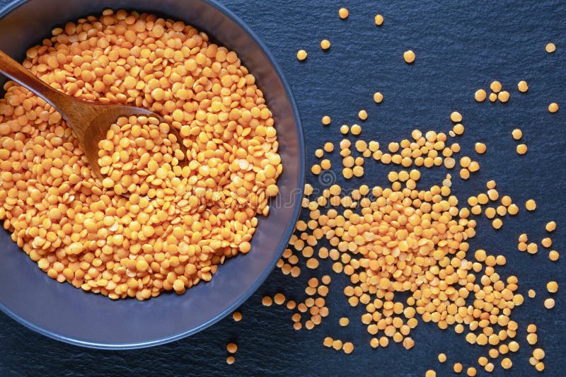 Dry Red Lentils in Plate on Dark Table Stock Image - Image of orange ...