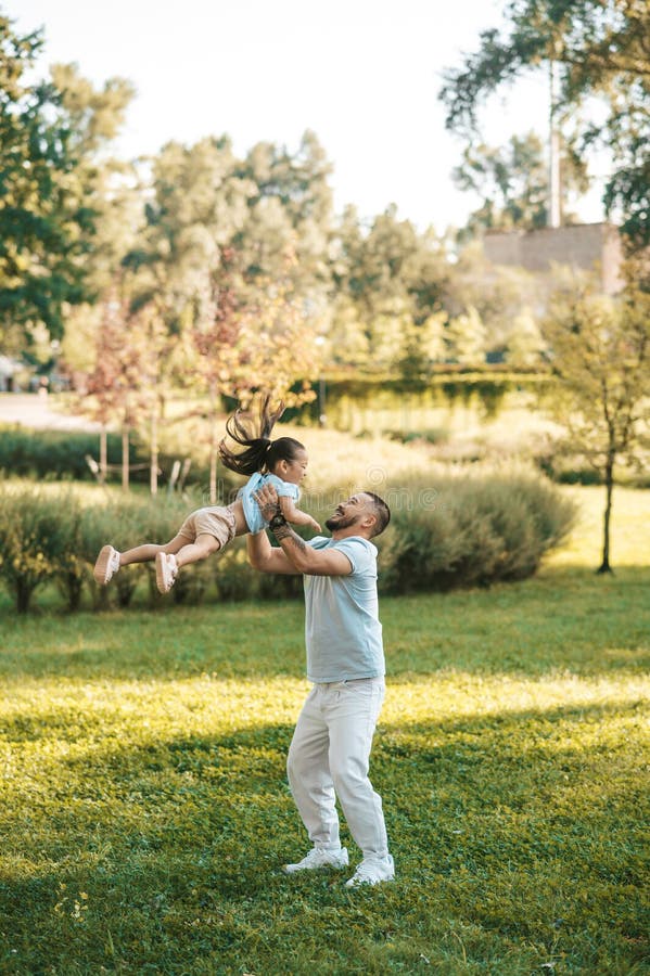 Dad and Daughter Having Fun in the Park and Looking Enjoyed Stock Photo ...