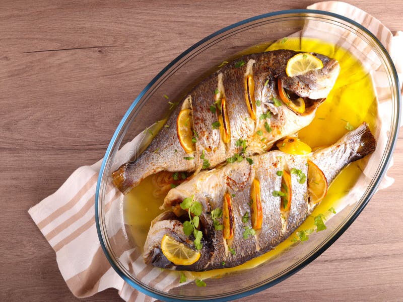 Baked Dorada Sea Bream Fish with Lemon Stock Image - Image of carrot ...