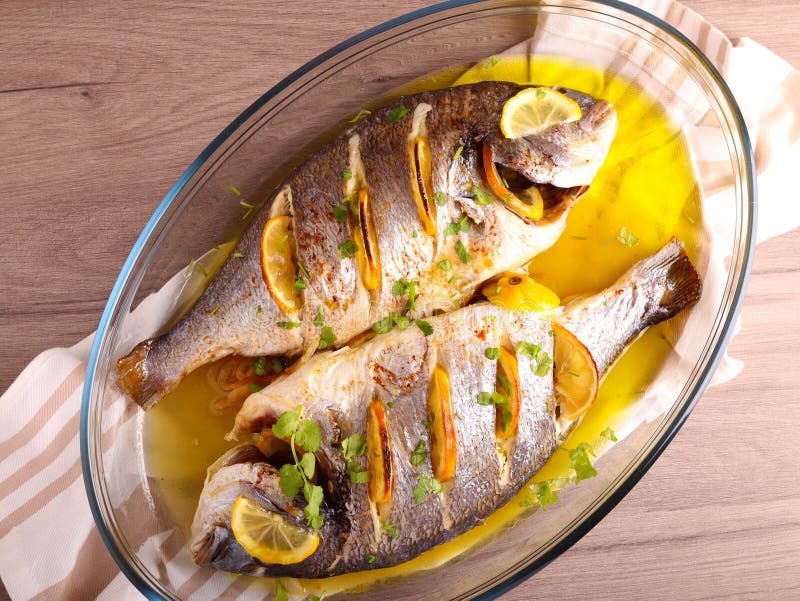 Lemon and baked fish. stock image. Image of lemon, lying - 177021145