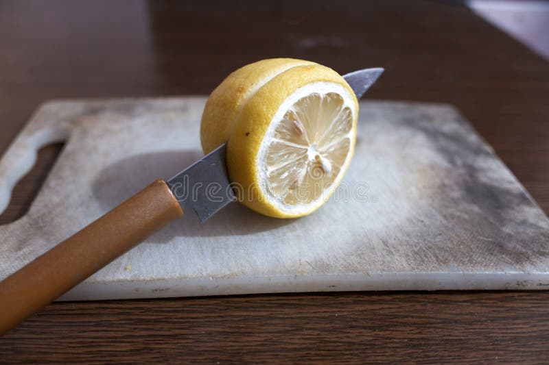 A Lemon Being Cut with a Knife Stock Photo - Image of indoors, sweet ...