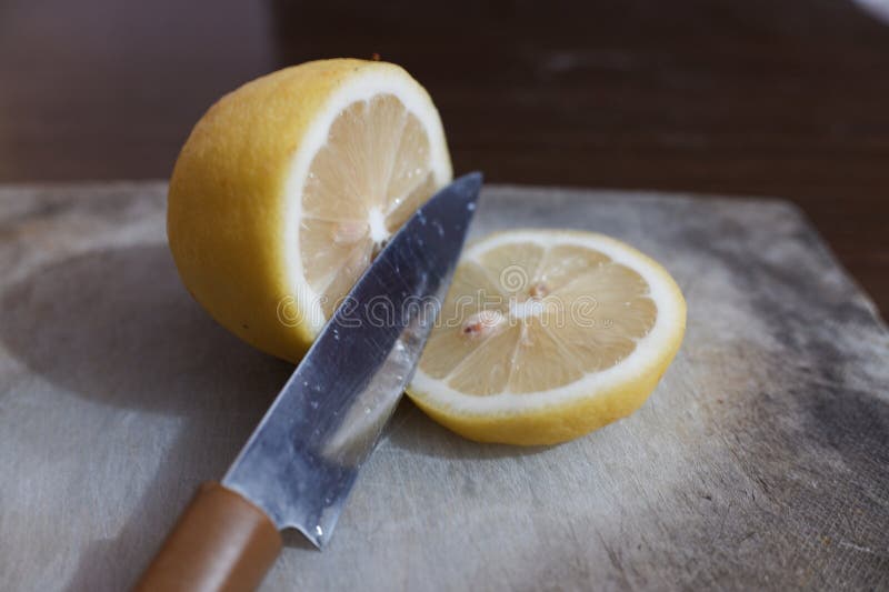 A Lemon Being Cut with a Knife Stock Image - Image of drink, acid ...