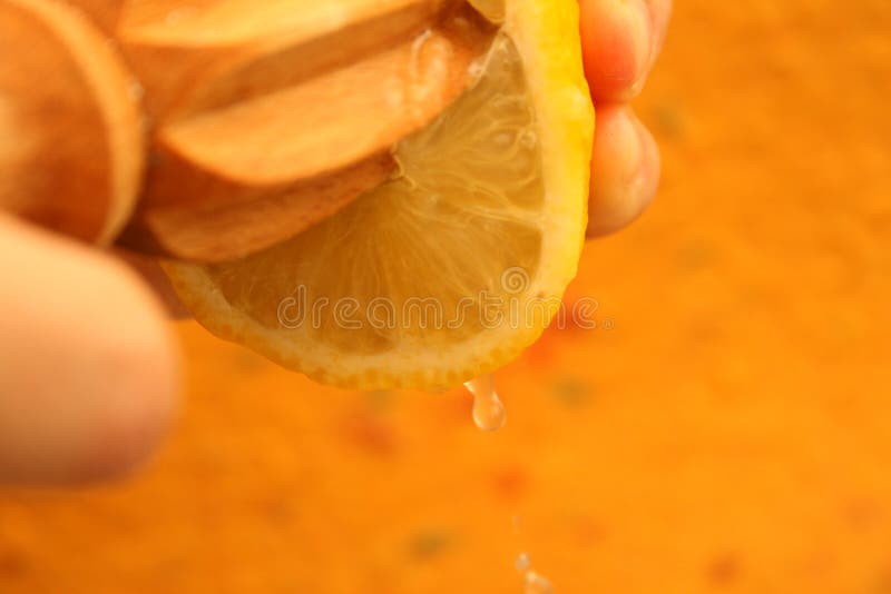 Lemon being squeezed stock photo. Image of juicy, squeezed - 3883982