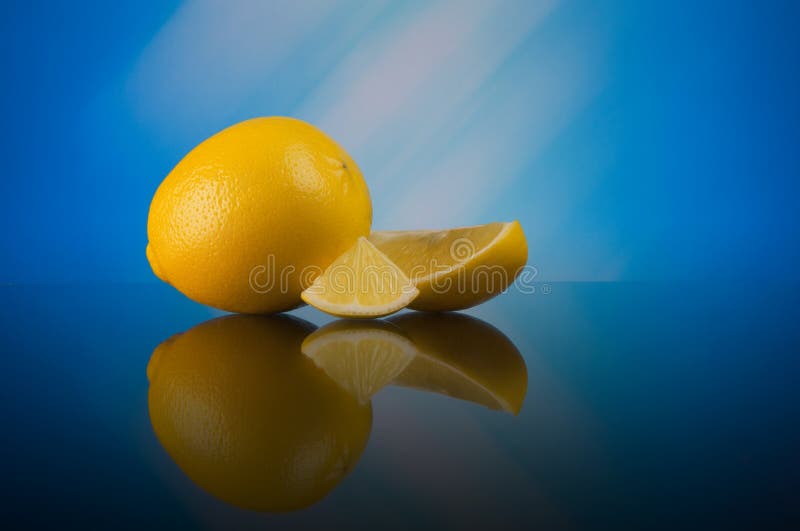 Lemon On A Blue Abstract Background With Reflection Stock Image - Image ...