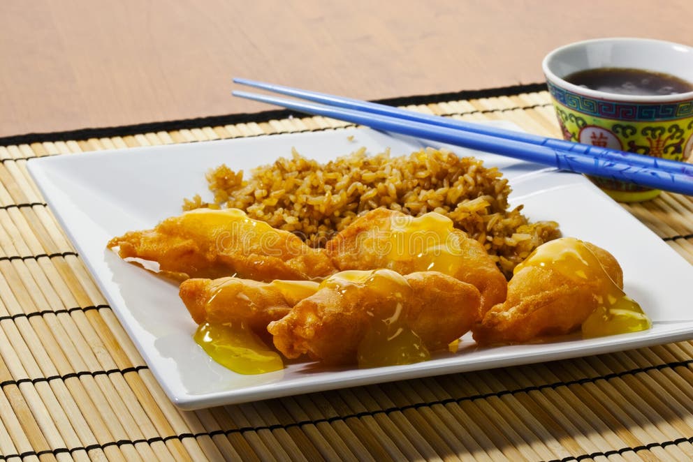 Lemon Chicken and Fried Rice Stock Photo - Image of colours, chopsticks ...