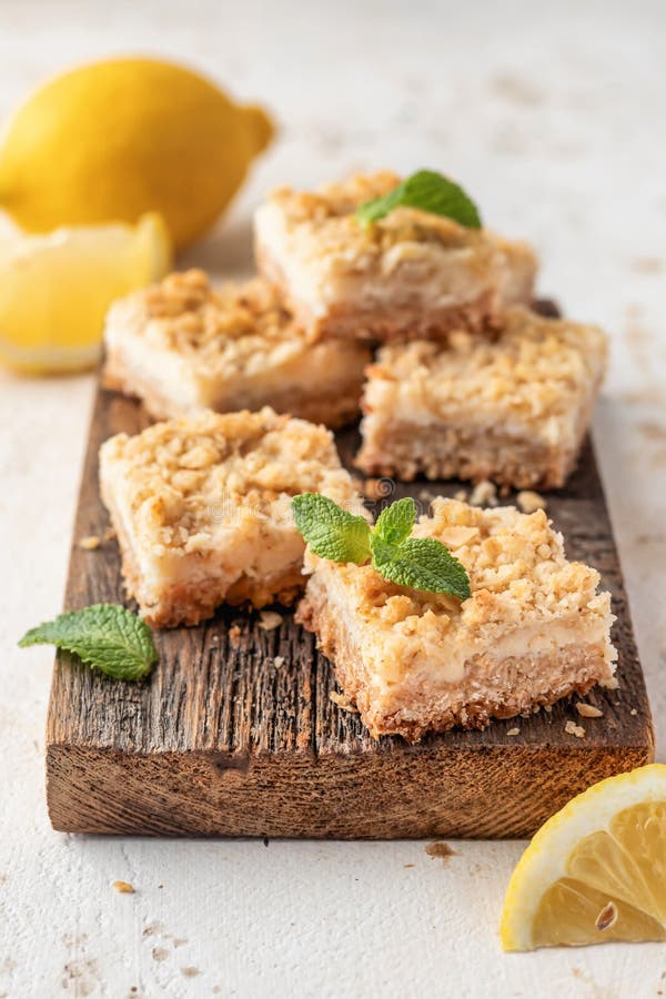Lemon Crumble Bars on Wooden Cutting Board, Oatmeal Lemon Bars Stock ...