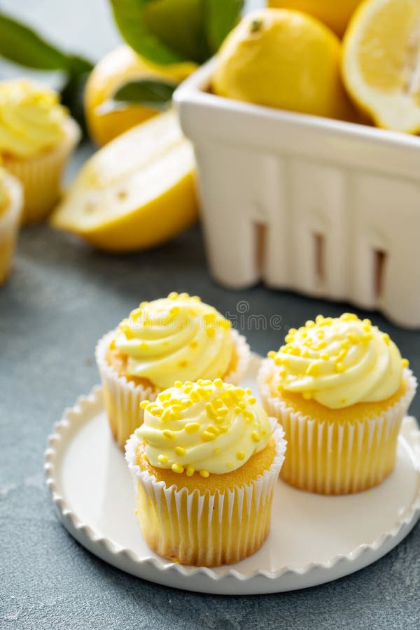 Lemon Cupcakes with Bright Yellow Frosting Stock Photo - Image of ...