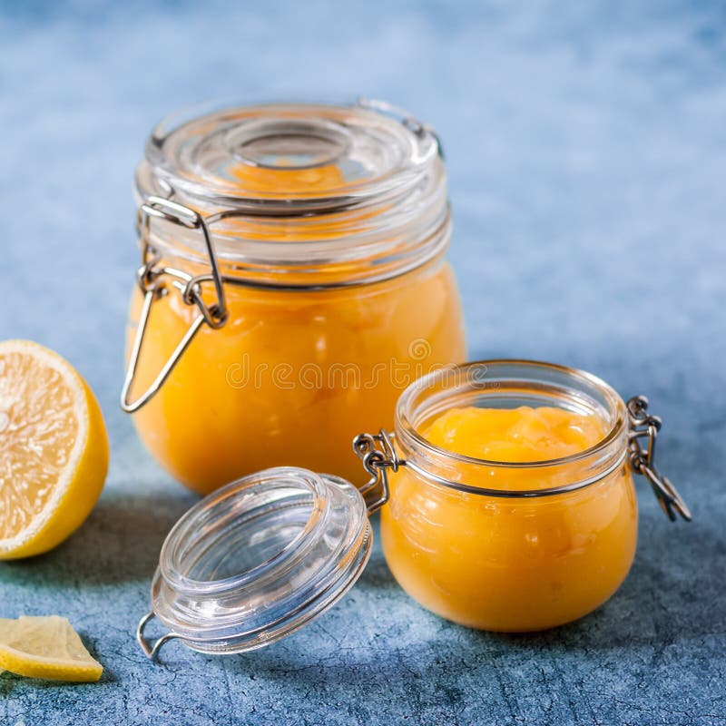 Lemon Curd in Jars Over Blue Background Stock Image - Image of organic ...
