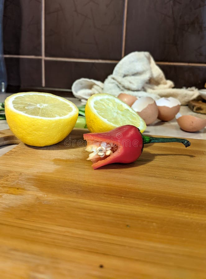 Lemon Cut in Half, Broken Red Pepper, Eggshells and Kitchen Utensils ...