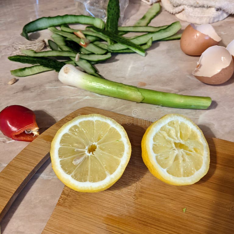 Lemon Cut in Half, Broken Red Pepper, Eggshells and Kitchen Utensils ...
