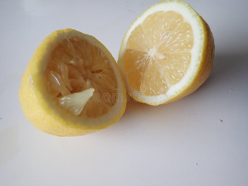 Lemon Cut into Halves on a Table Stock Image - Image of green, ripe ...