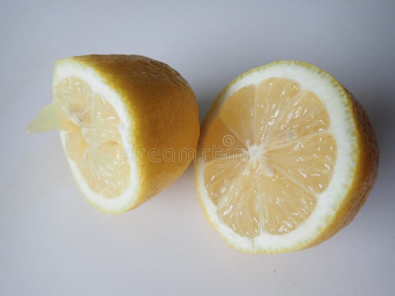 Lemon Cut into Halves on a Table Stock Photo - Image of diet, ripe ...