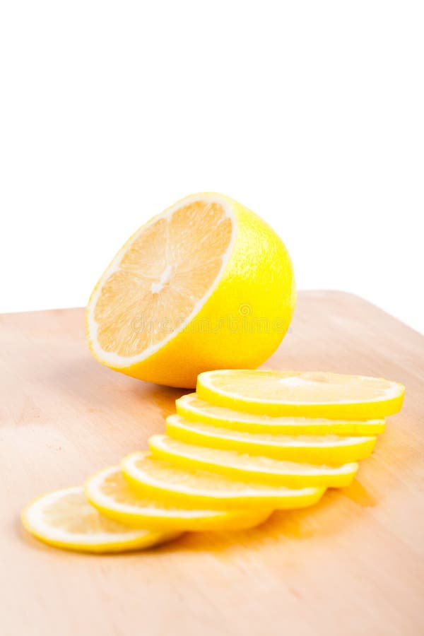 The Lemon Cut by Segments Lies on Chopping Board. Stock Image - Image ...