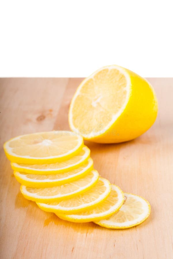 The Lemon Cut by Segments Lies on Chopping Board. Stock Image - Image ...