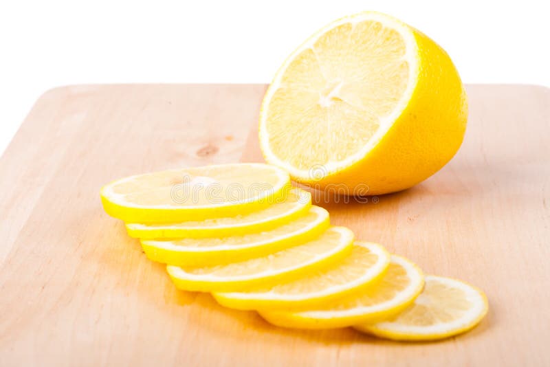 The Lemon Cut by Segments Lies on Chopping Board. Stock Photo - Image ...