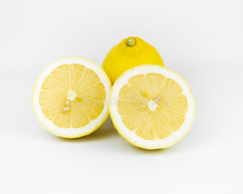 Lemon Cut into Two Peaces on White Background Stock Photo - Image of ...