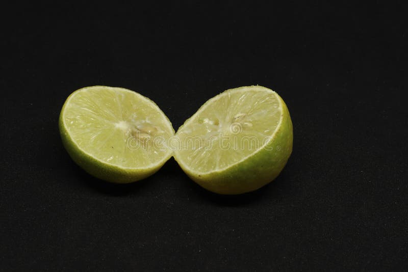 Lemon cut into two pieces. stock photo. Image of citron - 245563578