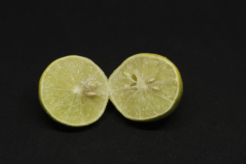 Lemon cut into two pieces. stock photo. Image of nature - 245563586