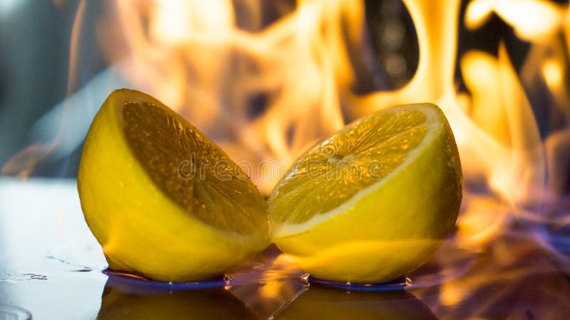Lemon in a flame of fire stock image. Image of symbol - 29643017