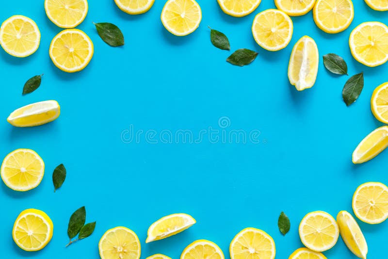 Lemon Frame. Sliced Citruses and Leaves on Blue Background Top View ...
