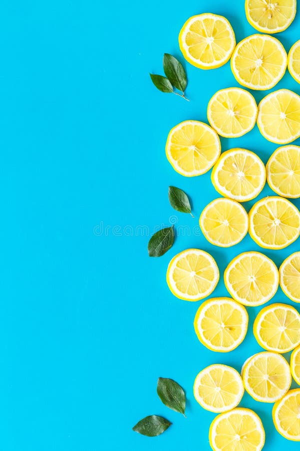 Lemon Frame. Sliced Citruses and Leaves on Blue Background Top View ...