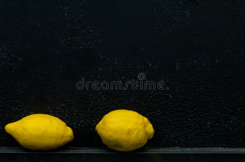 Lemon in Front of Rough Textured Black Background Stock Image - Image ...