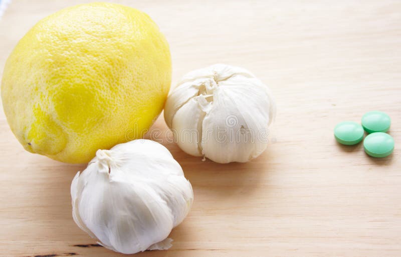 Lemon, garlic and tablets stock photo. Image of kitchen - 12924324