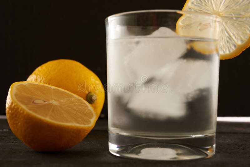 Lemon and a Glass of Ice Water Stock Photo - Image of fresh, texture ...