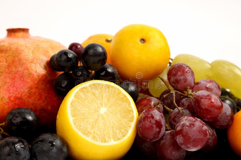 Lemon, Grapes and Pomegranate on White Background Stock Photo - Image ...
