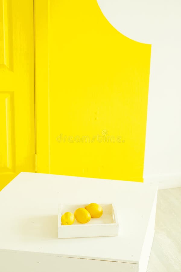 Bright Yellow Lemons on a Yellow Background. Lemons on a White Tray ...