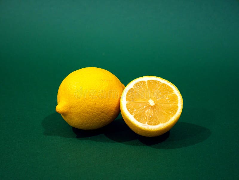 Lemon and Half of Lemon on Green Background Isolation Stock Image ...