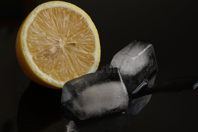 Lemon with Ice on a Black Background. Stock Photo - Image of dessert ...