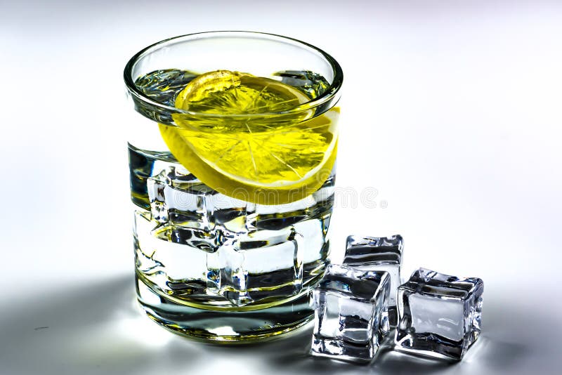 Lemon, ice cubes and water stock image. Image of cool - 194209967